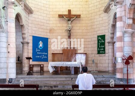 Cuban man praying inside Saint Joseph Catholic Church or parish, Cuba ...