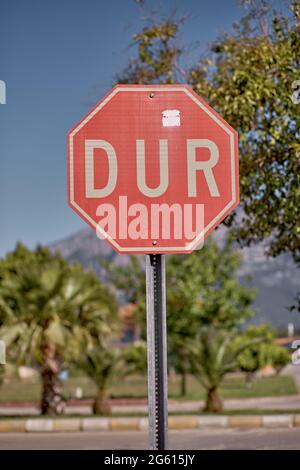 Red stop or DUR sign in Turkish Stock Photo - Alamy