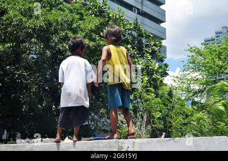 Two street children playing; Manila; Philippines Stock Photo - Alamy