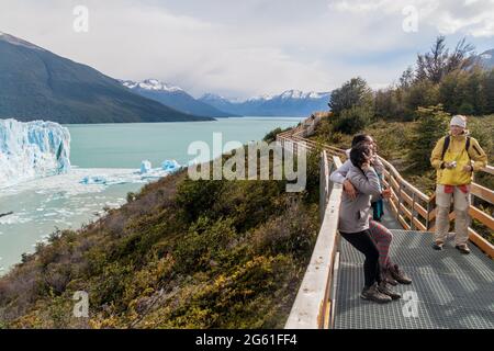 PERITO MORENO, ARGENTINA - MARCH 10, 2015: Tourists on boardwalks ...