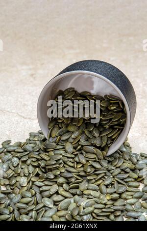 Fresh green pumpkin peeled seeds in the bowl Stock Photo - Alamy