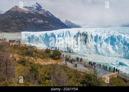 PERITO MORENO, ARGENTINA - MARCH 10, 2015: Tourists on boardwalks ...