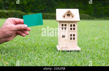 House and credit card. Invest in real estate concept Stock Photo - Alamy