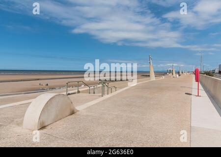 The image is of the seafront promenade with impressive lighting columns ...