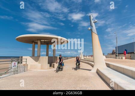 The image is of the seafront promenade with impressive lighting columns ...