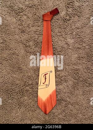 A vintage men's necktie with the letter M. Likely from the 1930s or ...
