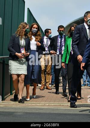 The Duchess of Cambridge (centre) and Tim Henman (right) attending day ...