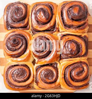 Delicious and sweet chocolate swirls on wooden background Stock Photo ...