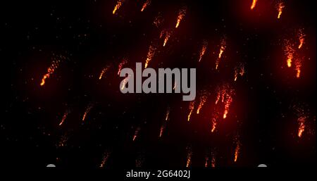 Glowing red firework exploding on black background with defocussed blue ...