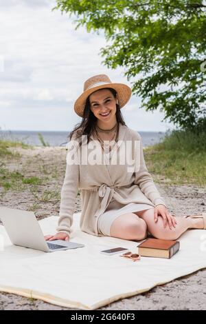 smartphone and earphones on picnic blanket Stock Photo - Alamy