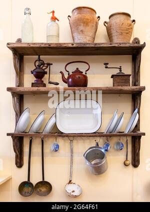 Old cooking utensils on shelves and the dresser in the Scullery, the ...