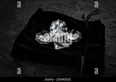 Beautiful shining crystal (diamond) in the tweezers, isolated on white ...