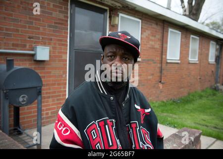 Gary, Indiana, USA. 28th Apr, 2021. Arion Knight, 44, sits outside his ...