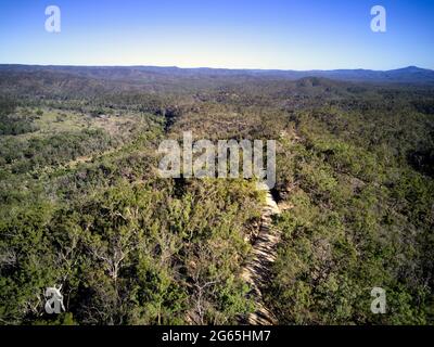 Aerial of the forested headwaters of the Kolan River in the Molangul ...