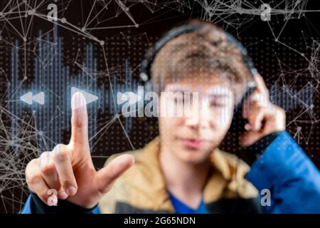 atrractive male use futuristic device to listen to music Stock Photo ...