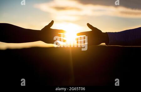Outstretched hands, salvation, help silhouette, concept help. Giving a helping hand. Rescue ...