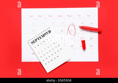 Calendars with marked date and marker on color background Stock Photo ...