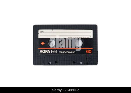 Red AGFA audio cassette, retro audio technology, on white background ...