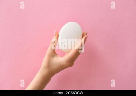 Female hand with soap on color background Stock Photo - Alamy