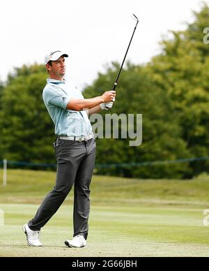 Lucas Herbert of Australia plays his second shot at the eighteenth hole ...