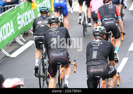 Riders corssing the finish line in stage 8 of the Tour de France ...