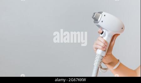 Laser hair removal end epilation concept: beautician applying laser ...