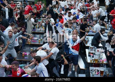 Fans in BoxPark Croydon, celebrate Harry Kane's first goal as they ...