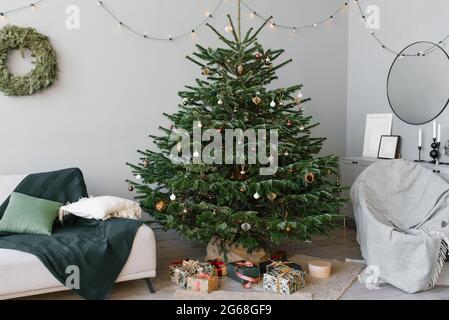 gray armchair with red pillows in the interior Stock Photo - Alamy