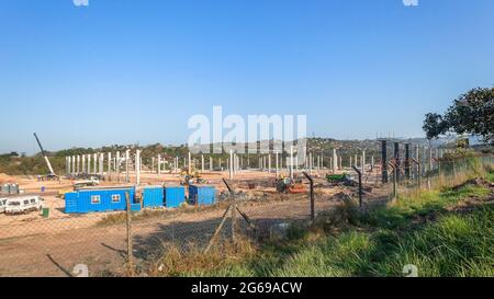 The concrete foundations for the columns of a factory building are ...