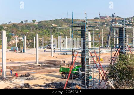 The concrete foundations for the columns of a factory building are ...
