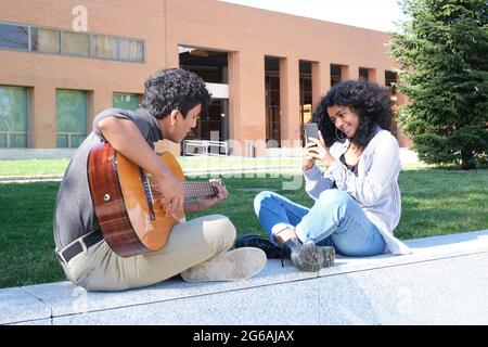 Photo of young couple playing video games at home at night Stock Photo ...