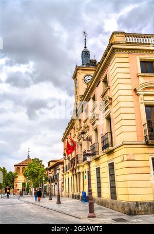 The town hall in Alcala de Henares with flags and a Gay Pride rainbow ...