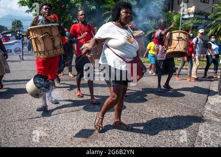Garifuna drummers perform during the demonstration. Protest against the ...