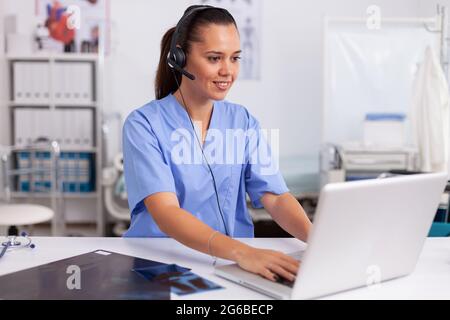 Portrait of medical secretary typing report Stock Photo - Alamy