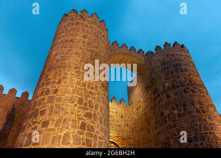 Alcazar Gate of the medieval city wall of Avila at dusk, Spain Stock ...