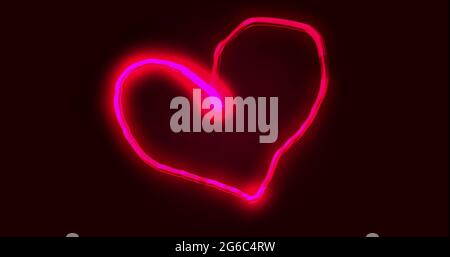 Heart trails forming a heart shape against black background Stock Photo ...