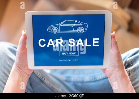 Tablet screen displaying a car sale concept Stock Photo - Alamy