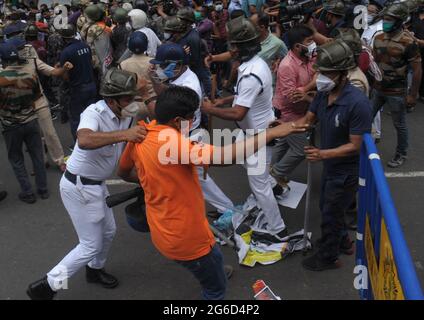 Kolkata, India. 05th July, 2021. Kolkata police personnel clash with BJP activists during a ...