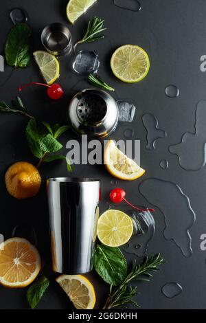 Shaker with ingredients for making cocktails. Dark background. Top view ...