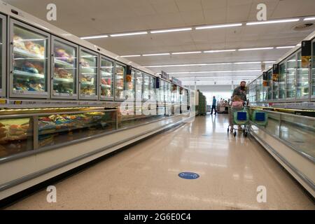 Tesco frozen food freezer aisle, uk Stock Photo - Alamy
