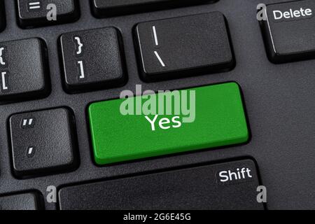 Verify on black keyboard with green key Stock Photo - Alamy