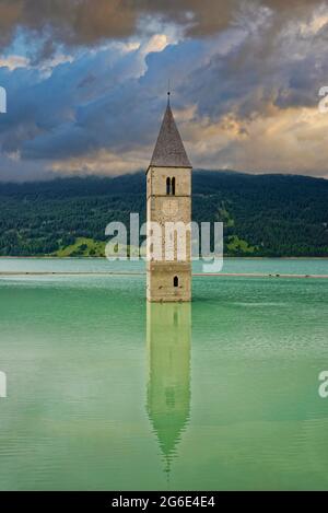 Italy, Alto Adige, Graun im Vinschgau, church tower in lake Reschensee ...