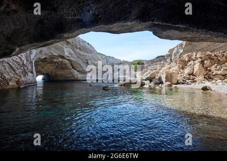 Cauldron-like rock walls of the collapsed cave Sykia, Milos, Cyclades ...