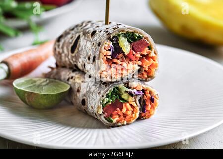 Mango Carrot Sprout and Hummus with Sweet Purple Tortilla wrap Stock ...