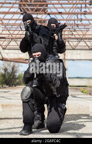 Russian special forces operators in black uniform and bulletproof ...
