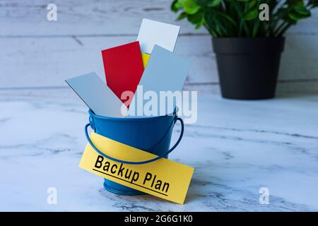 Colorful paper inside of a blue bucket with 2024 label Stock Photo - Alamy