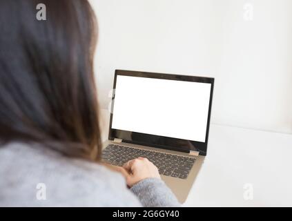 Mockup image of a woman using and typing on laptop with blank white ...