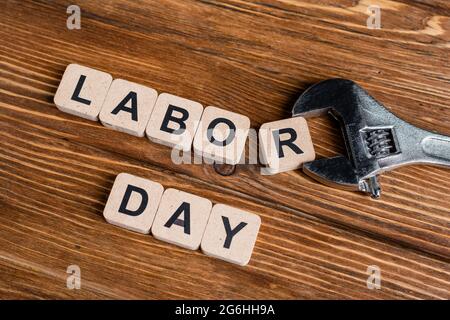 wrench near cubes with labor day lettering on wooden table Stock Photo ...