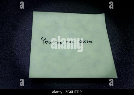 Writing words on a piece of note paper Stock Photo - Alamy