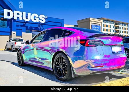 Tesla car with Purple blue, shifting Chameleon colors Stock Photo - Alamy